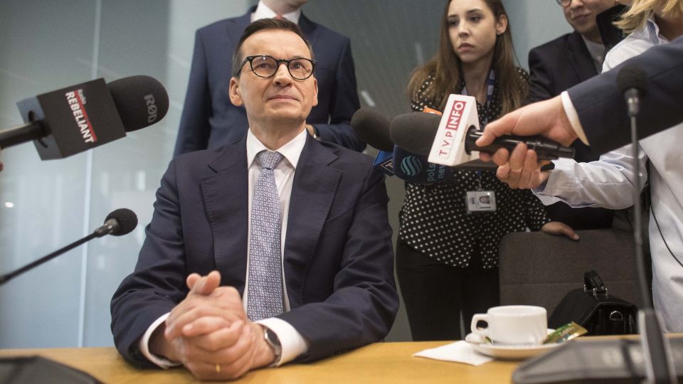 Former Polish prime minister pleads innocence in visas-for-cash scandal Former Polish prime minister pleads innocence in visas-for-cash scandal
